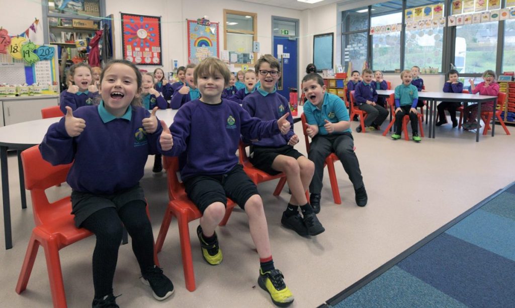 Smiles as the youngest learners return to school - Herald.Wales