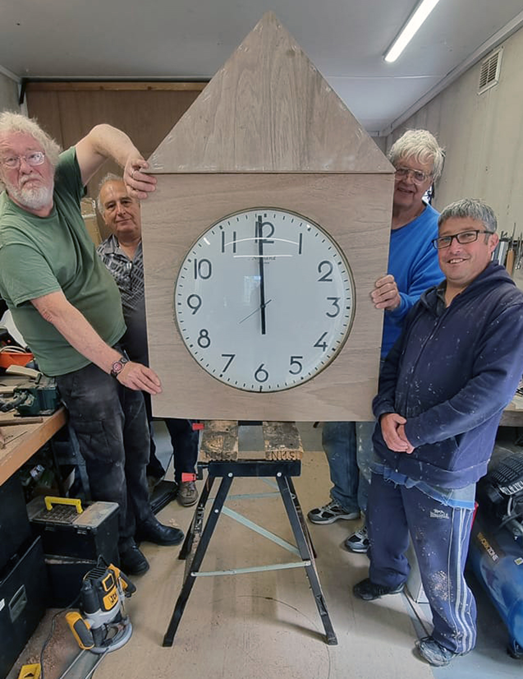 Neyland’s Men’s Shed assist with installation of new clock - Herald.Wales