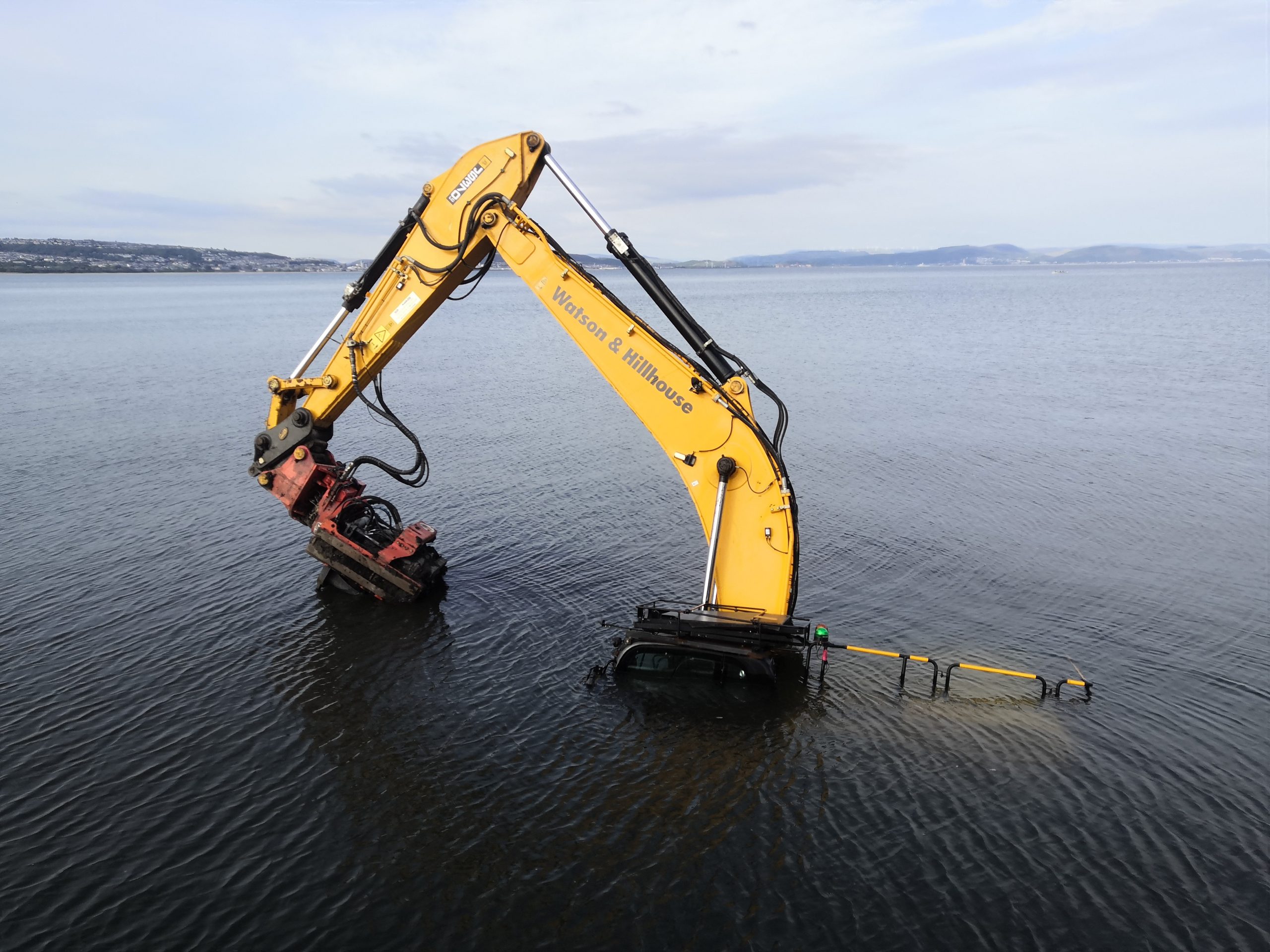 Digger gets stranded in sea off Mumbles - Herald.Wales