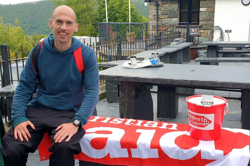 Grandson celebrates after tackling three Welsh peaks in a day, in ...